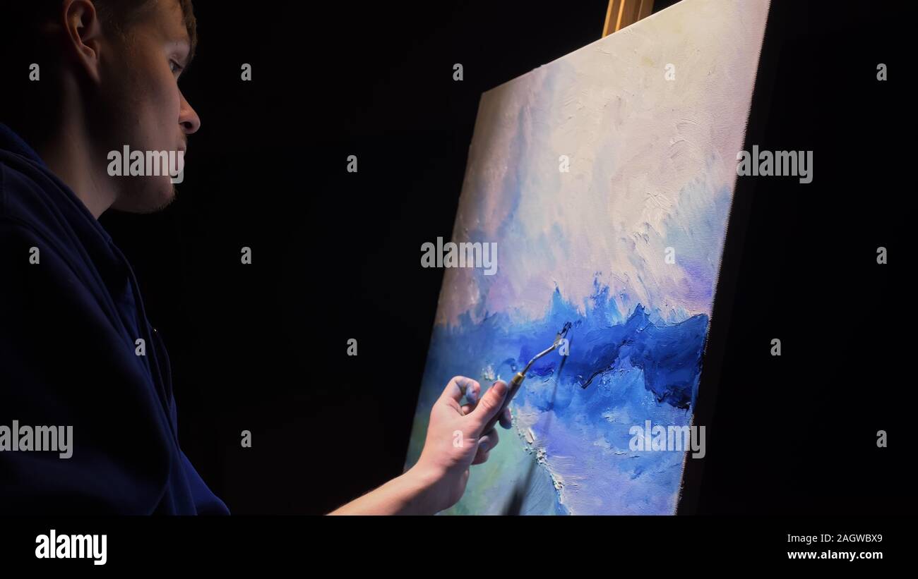 Artist copyist paint seascape with ship in ocean. Craftsman decorator ...