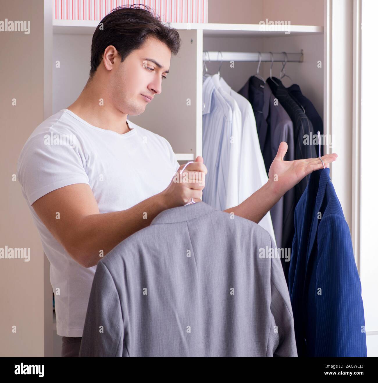 Man getting dressed confused hi-res stock photography and images - Alamy