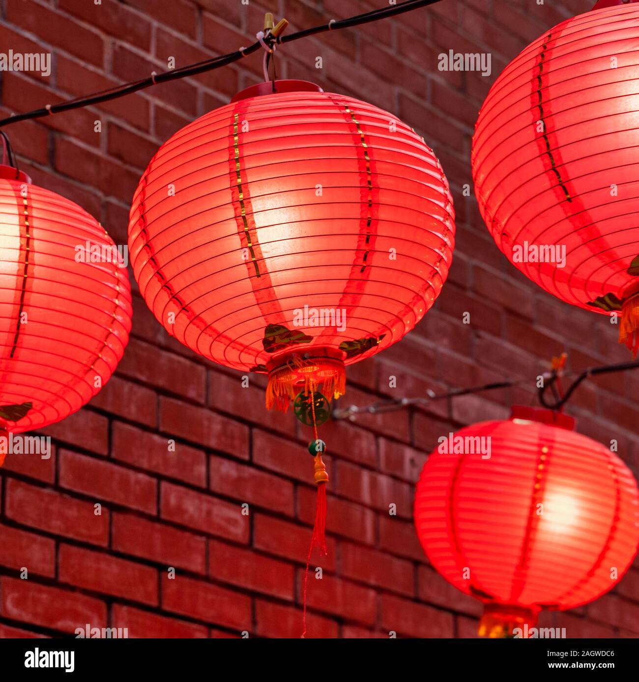 Beautiful round red lantern hanging on old traditional street, concept ...