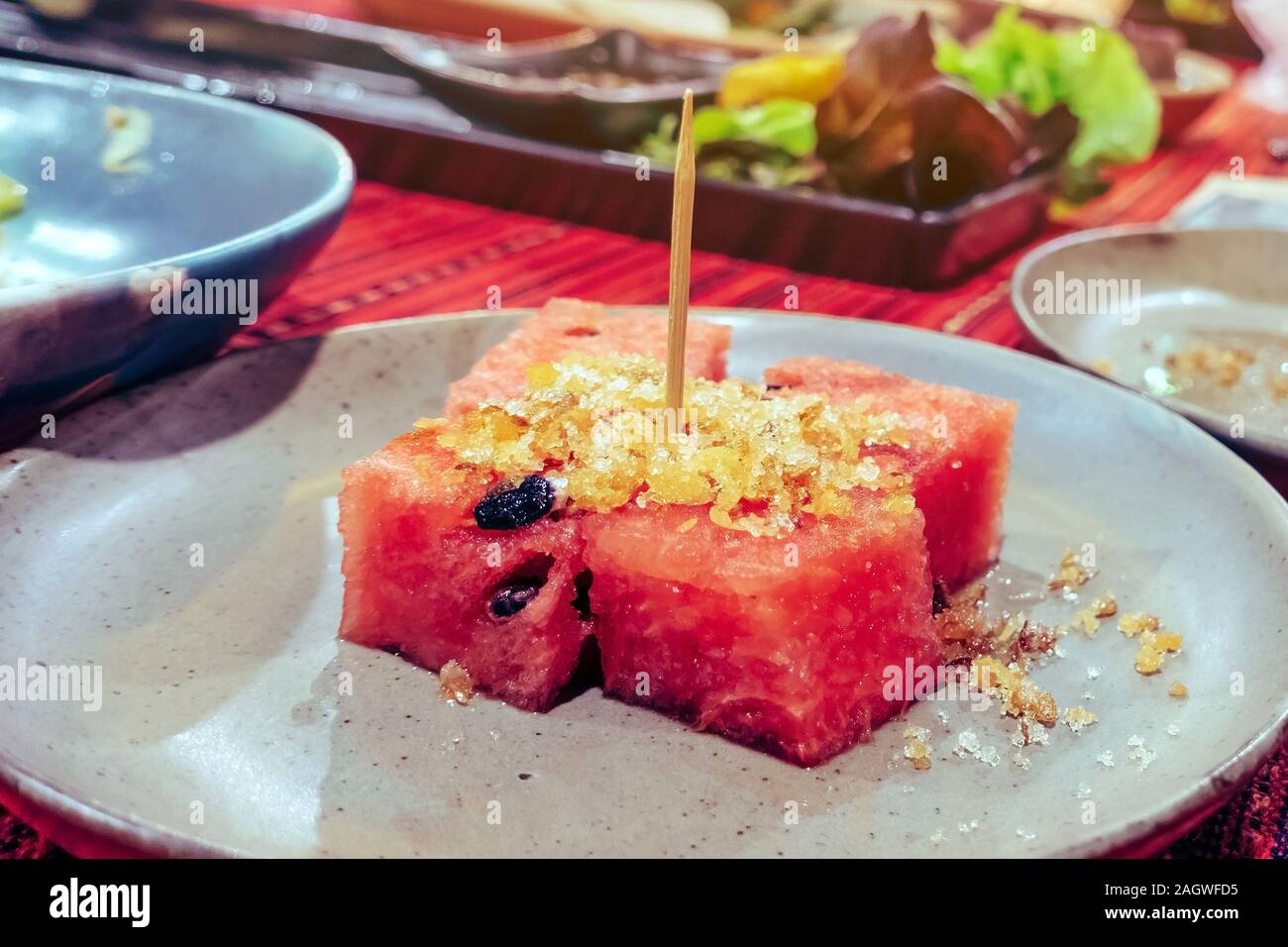 Fried dried fish with watermelon served as a dessert for party dinner ...