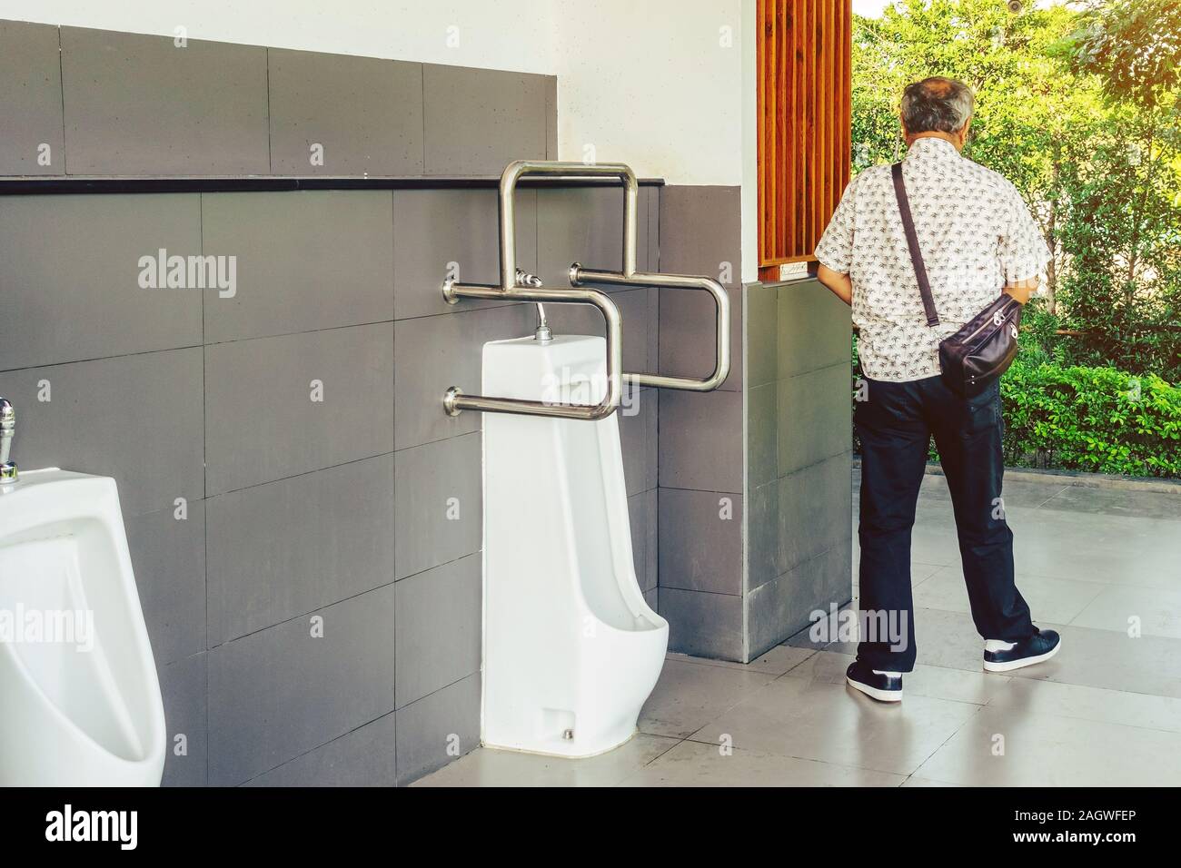 Clean and modern public men toilet with friendly design for people with ...