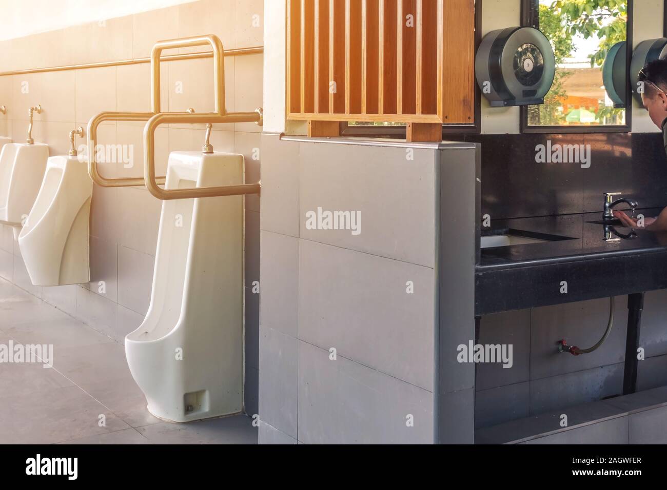 Clean and modern public men toilet with friendly design for people with ...