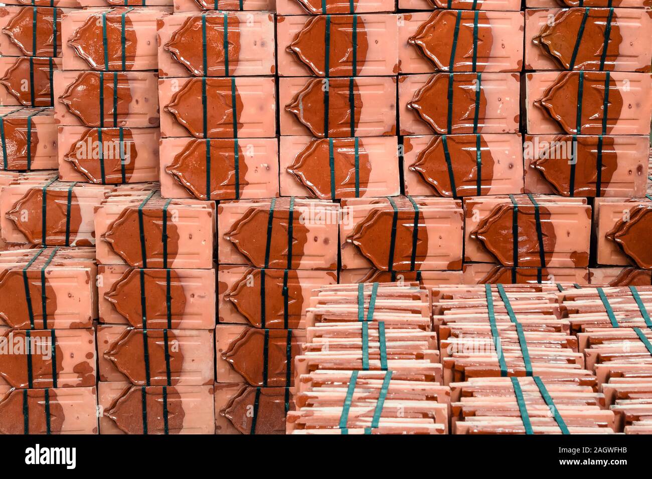 Close up to many pile of roof tiles traditional clay stack for a ...