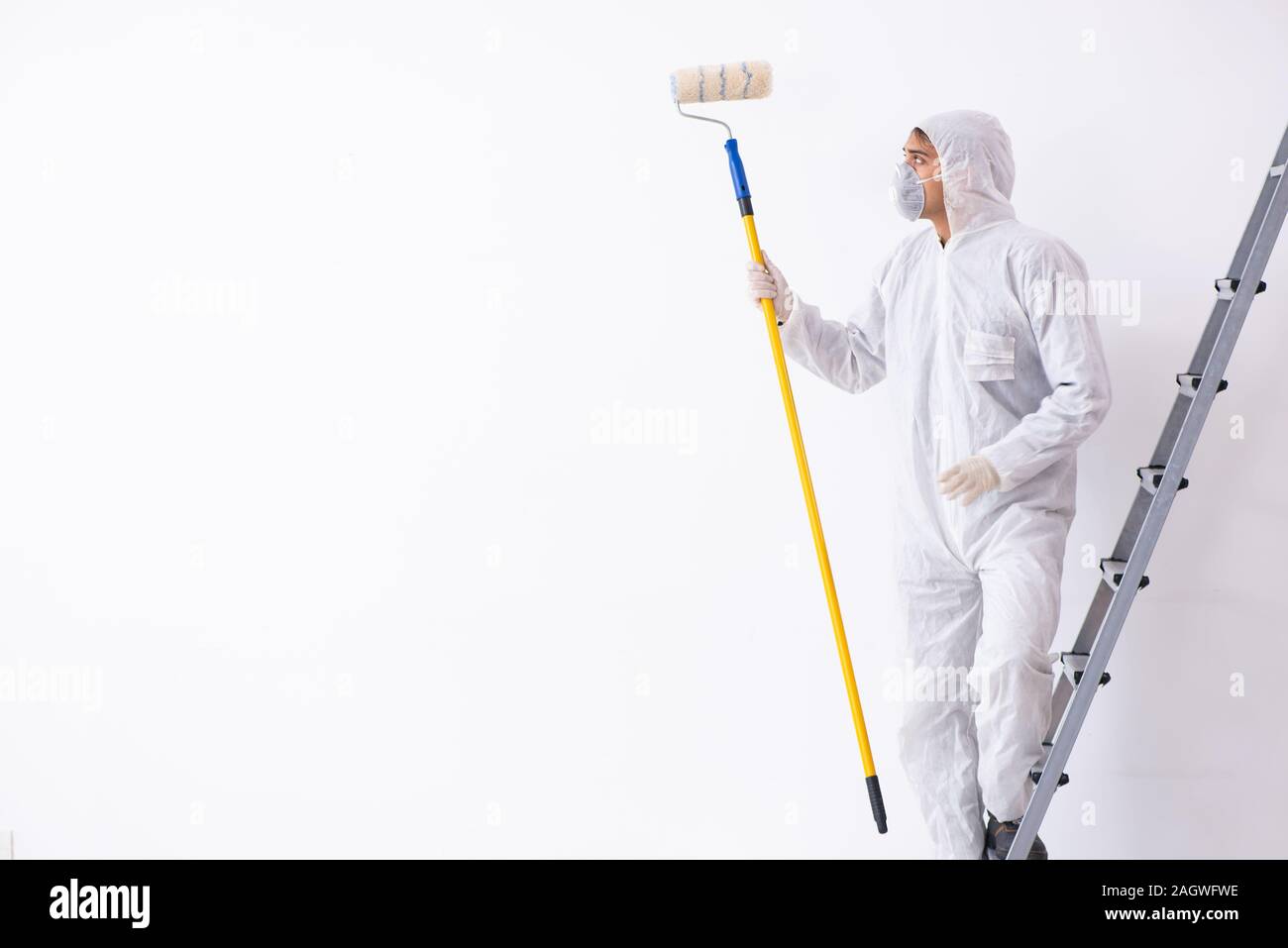 Painter working at the construction site Stock Photo - Alamy