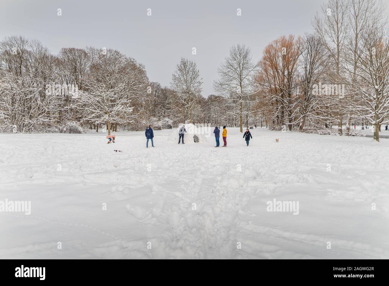 Winter scene at a park, people are playing in the snow Stock Photo - Alamy