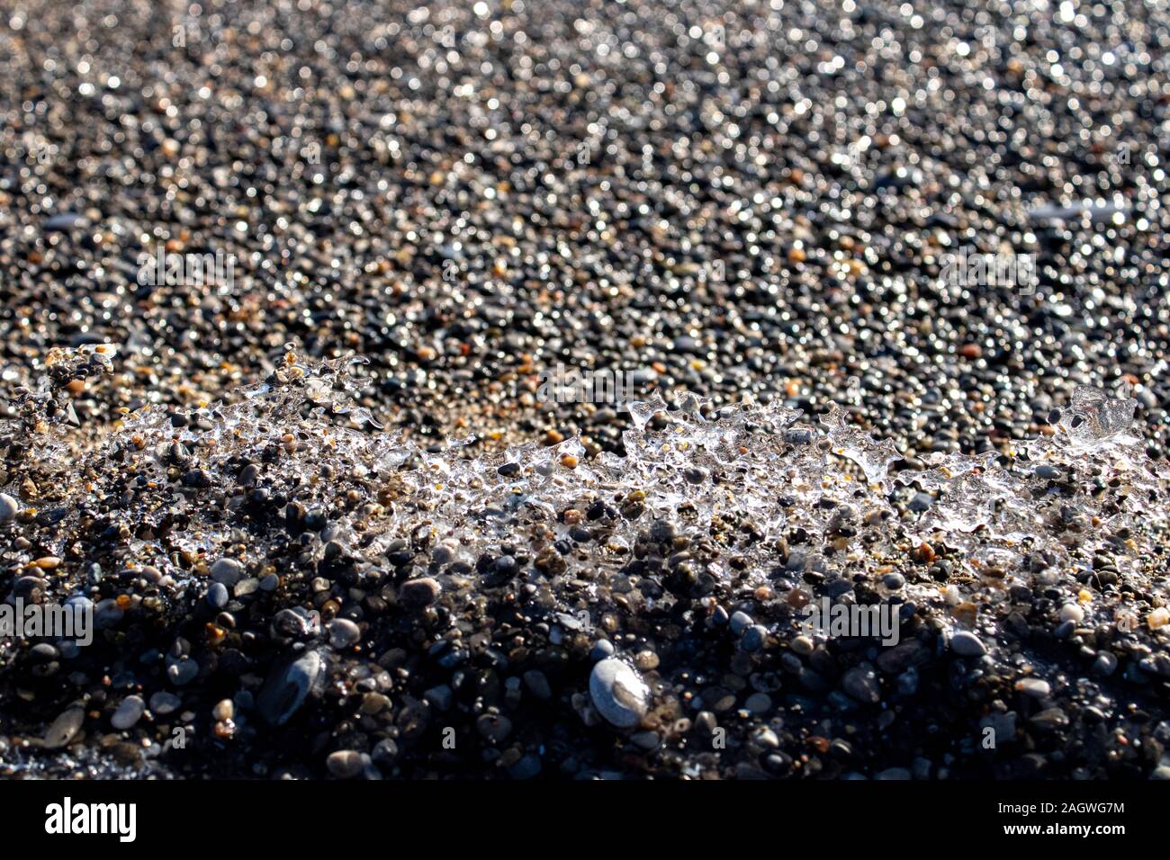 Frozen pebbles on a beach in winter Stock Photo - Alamy