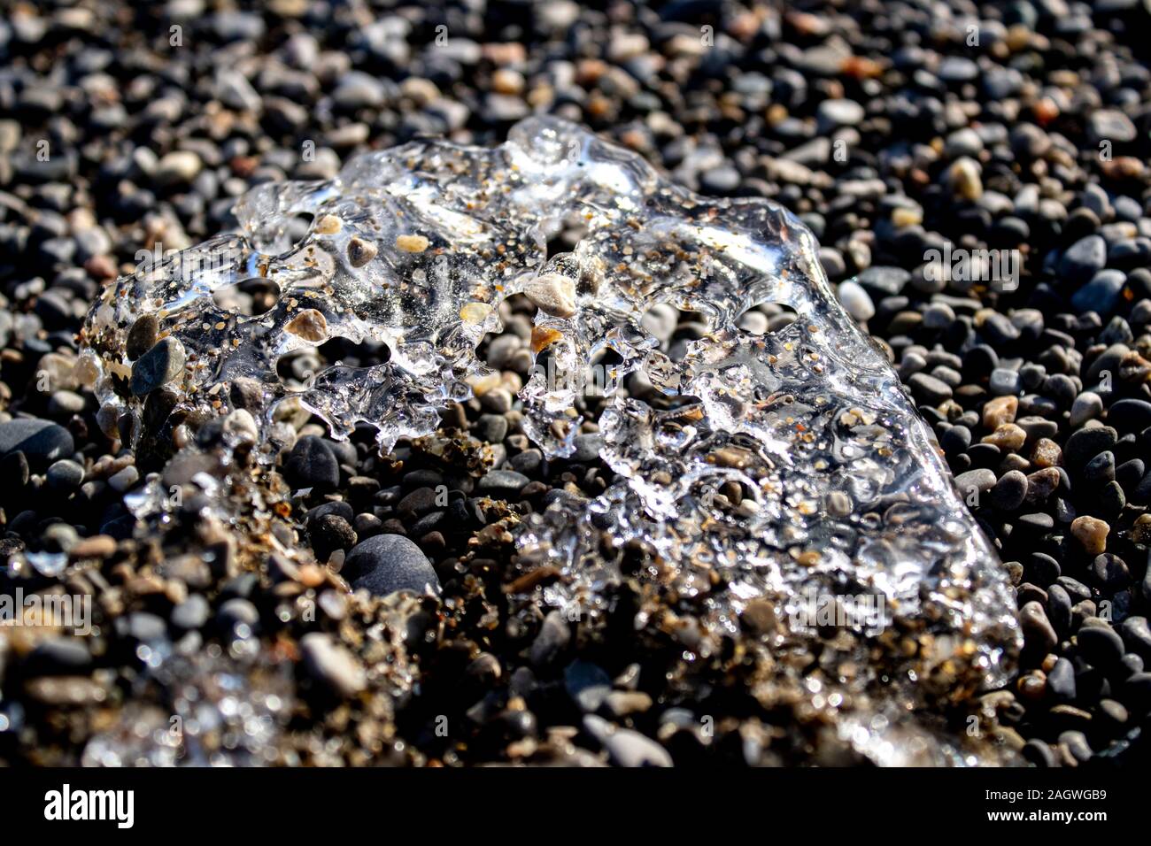 Beautiful ice shapes from objects in the beach Stock Photo - Alamy