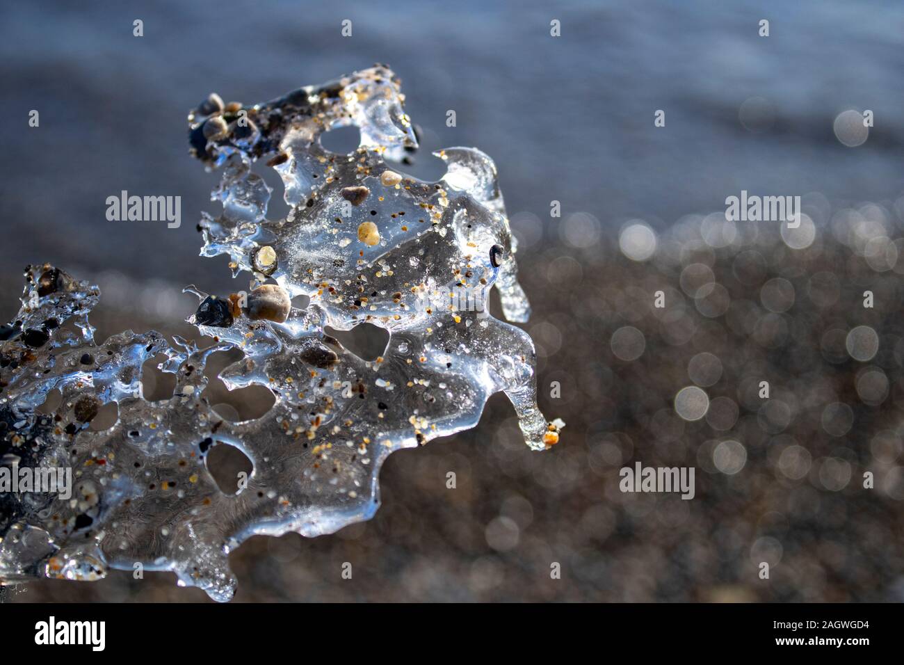 Beautiful ice shapes from objects in the beach Stock Photo - Alamy