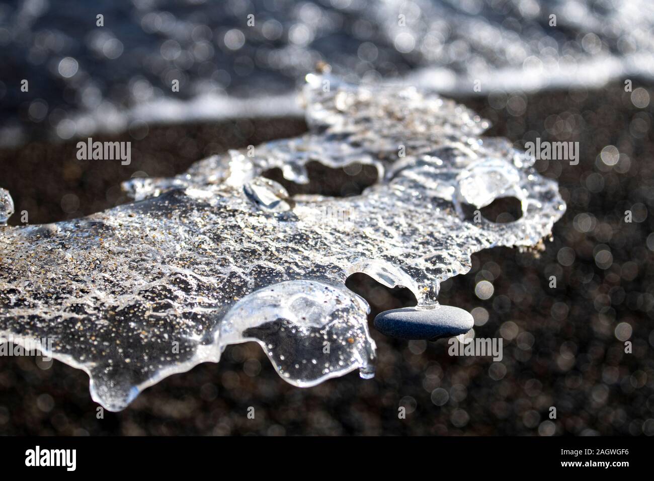 Beautiful ice shapes from objects in the beach Stock Photo - Alamy