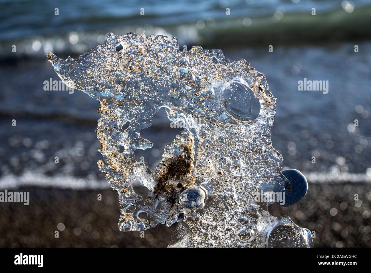Beautiful ice shapes from objects in the beach Stock Photo - Alamy