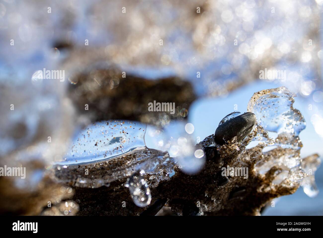 Beautiful ice shapes from objects in the beach Stock Photo - Alamy