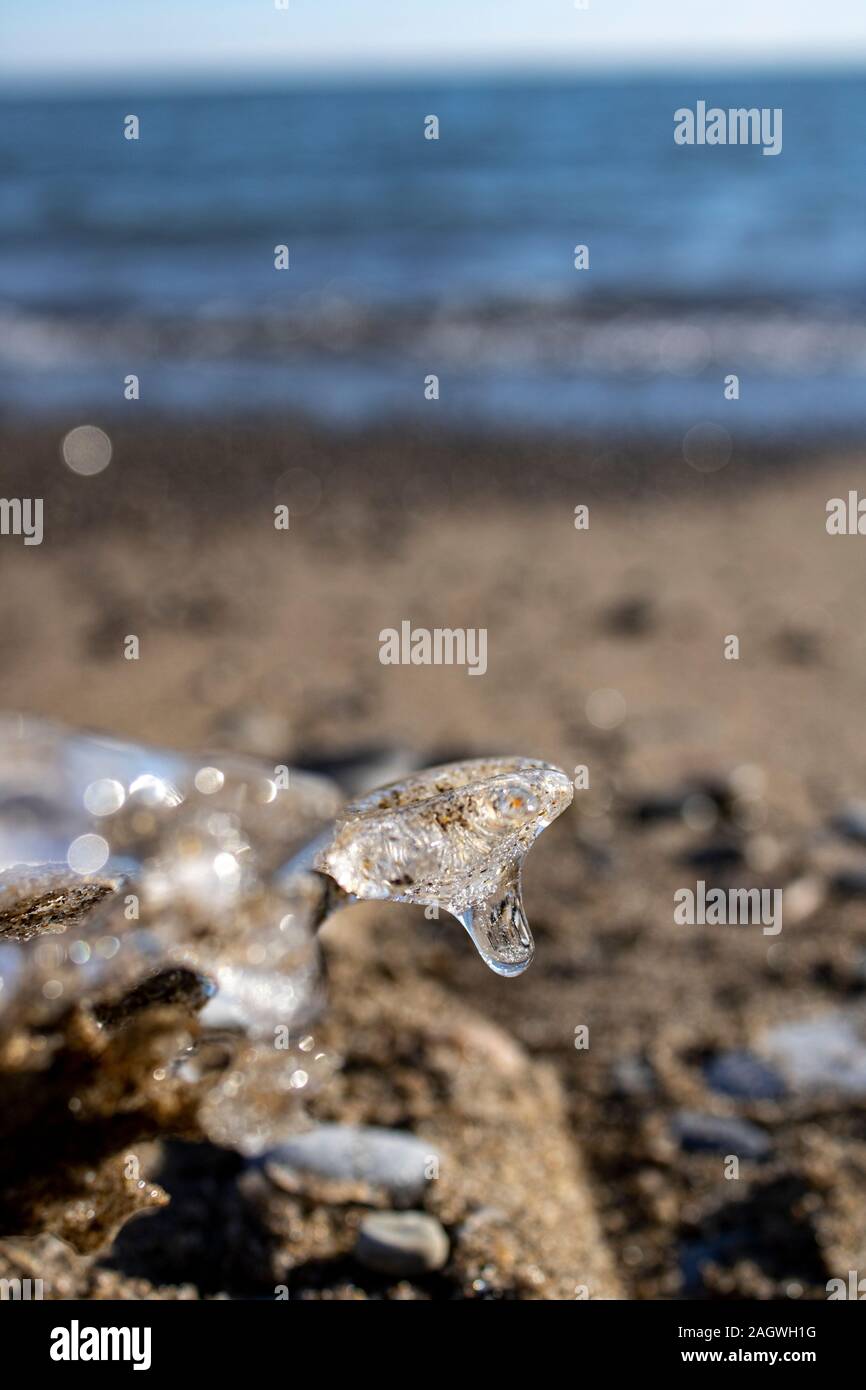 Beautiful ice shapes from objects in the beach Stock Photo - Alamy