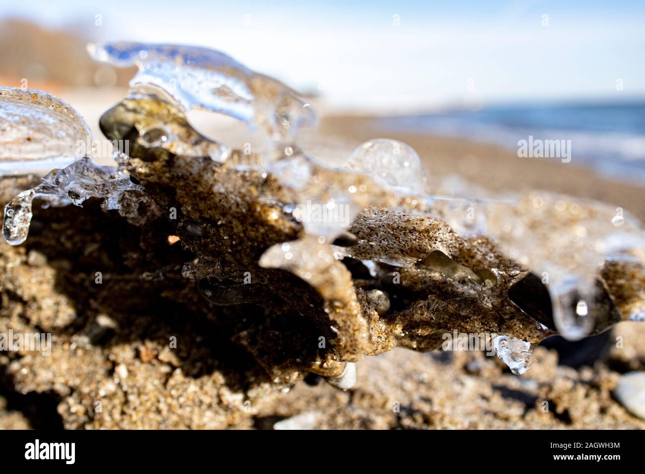 Beautiful ice shapes from objects in the beach Stock Photo - Alamy