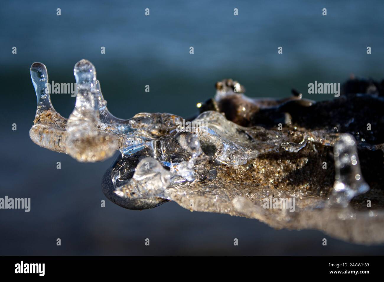 Beautiful ice shapes from objects in the beach Stock Photo - Alamy