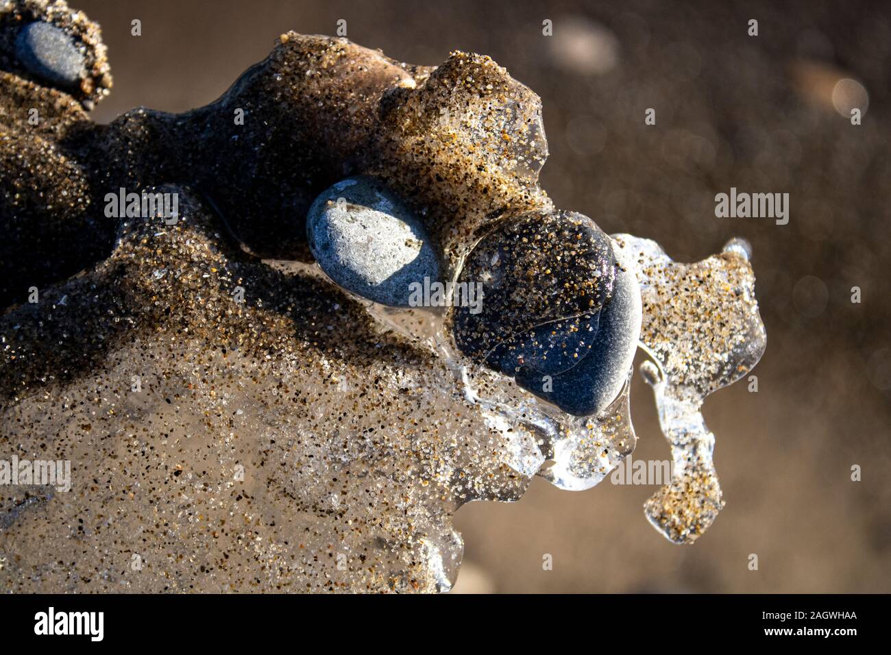 Beautiful ice shapes from objects in the beach Stock Photo - Alamy