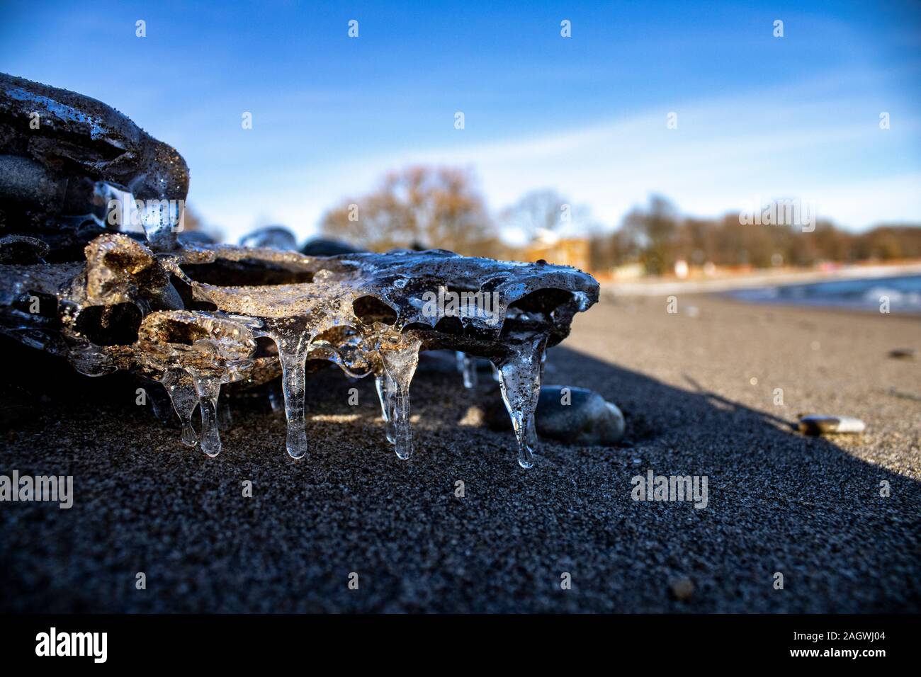 Beautiful ice shapes from objects in the beach Stock Photo - Alamy