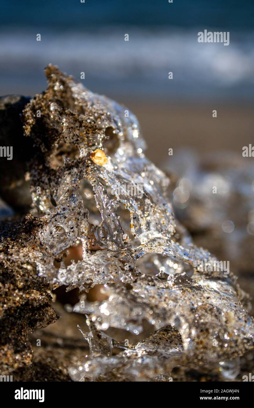 Beautiful ice shapes from objects in the beach Stock Photo - Alamy