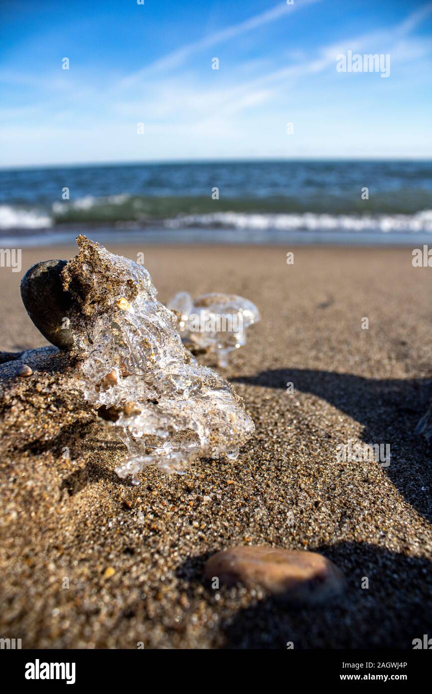 Beautiful ice shapes from objects in the beach Stock Photo - Alamy