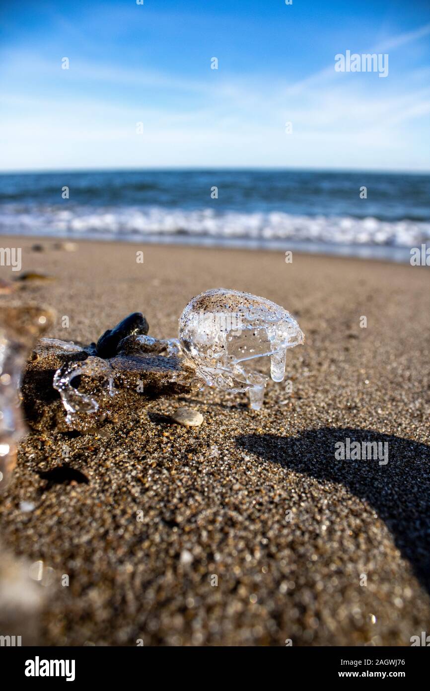 Beautiful ice shapes from objects in the beach Stock Photo - Alamy