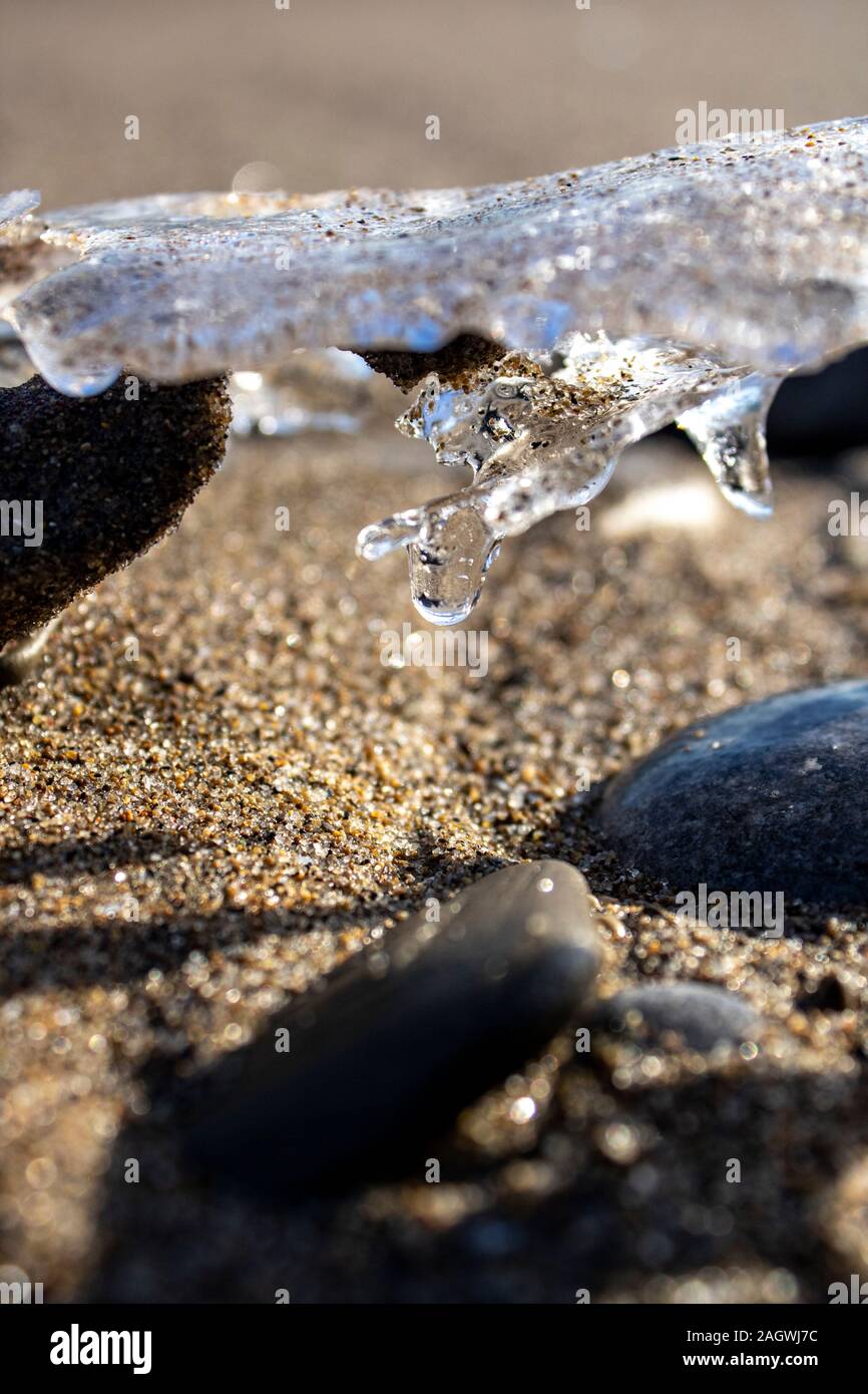 Beautiful ice shapes from objects in the beach Stock Photo - Alamy