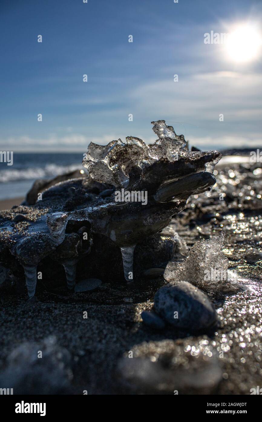 Beautiful ice shapes from objects in the beach Stock Photo - Alamy