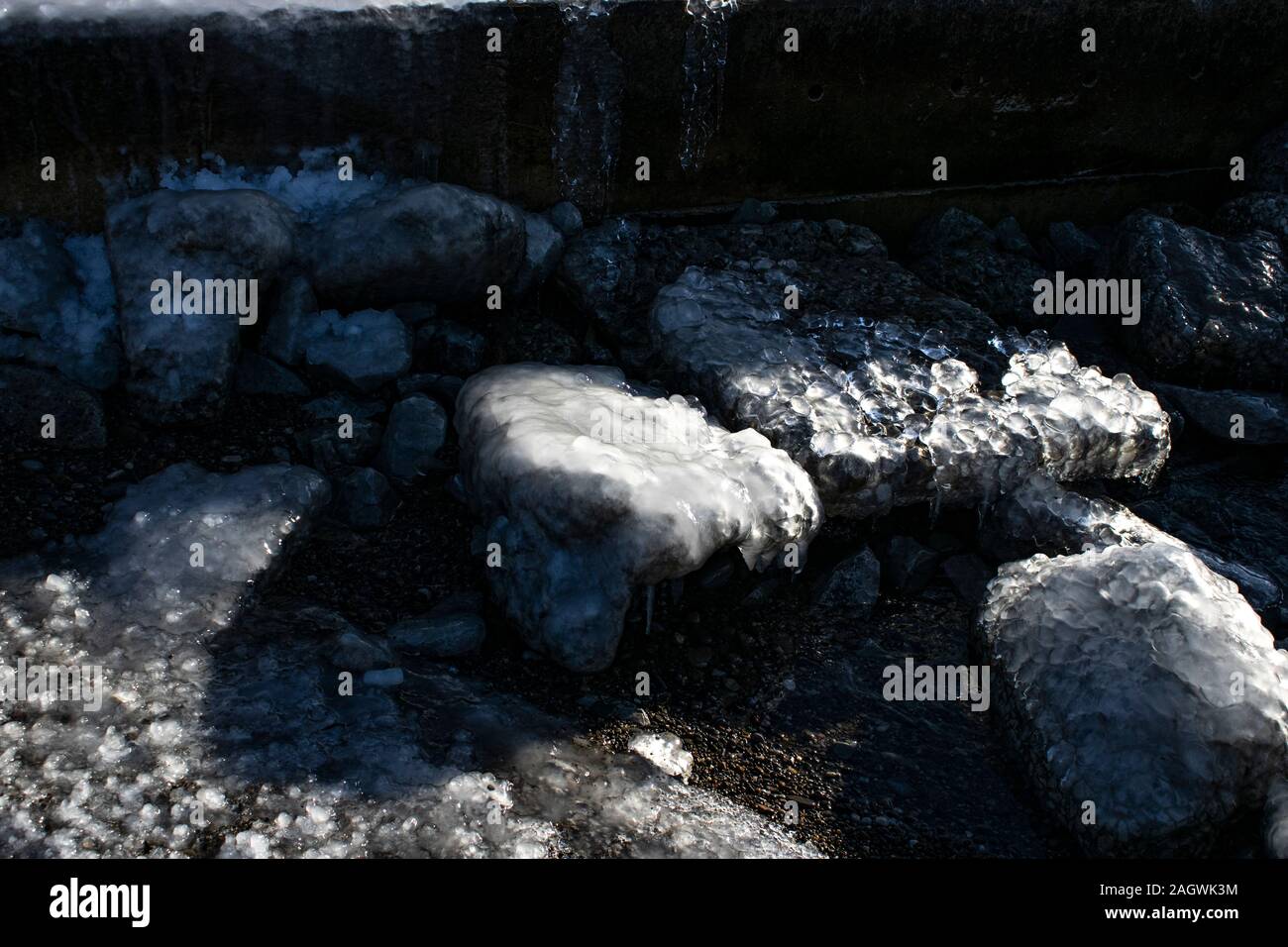 Frozen rocks on a beach in winter Stock Photo - Alamy