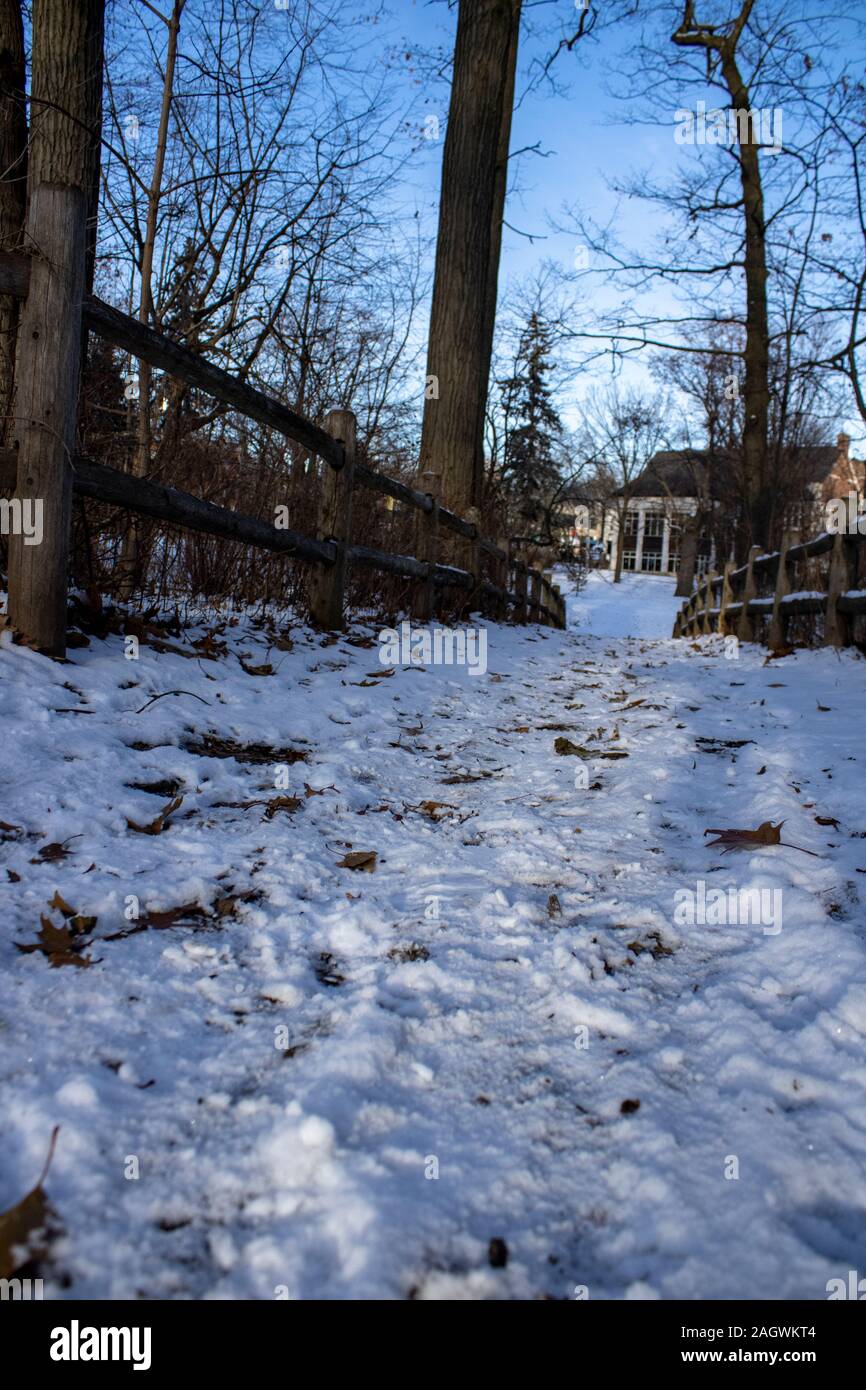 Snow on a path in park Stock Photo - Alamy