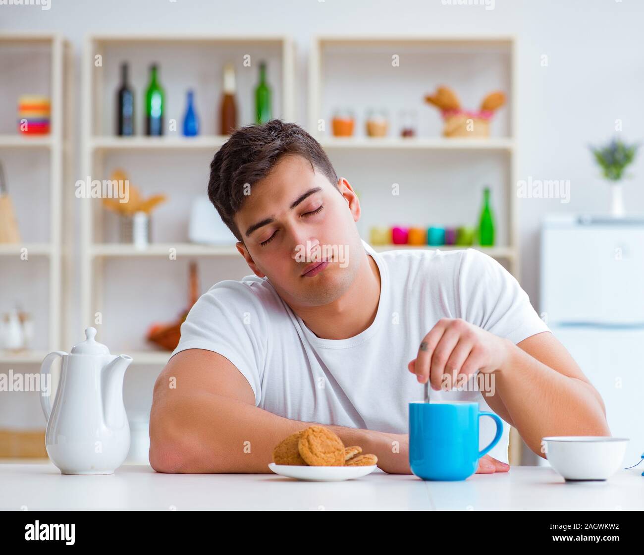 The man falling asleep during his breakfast after overtime work Stock ...