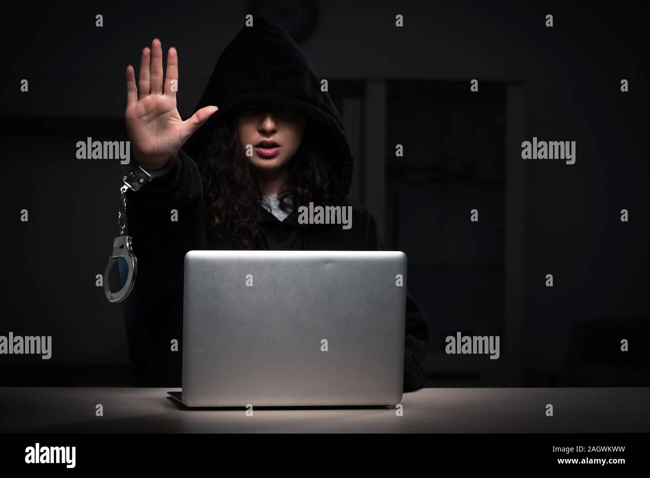 The female hacker hacking security firewall late in office Stock Photo ...