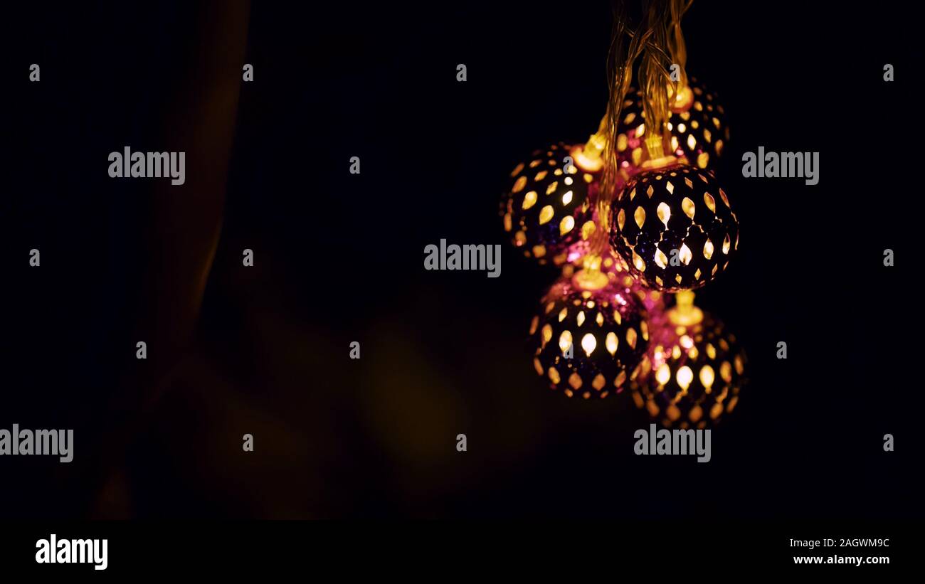 Magic lanterns spin and give beautiful glare to the walls. New Year ...