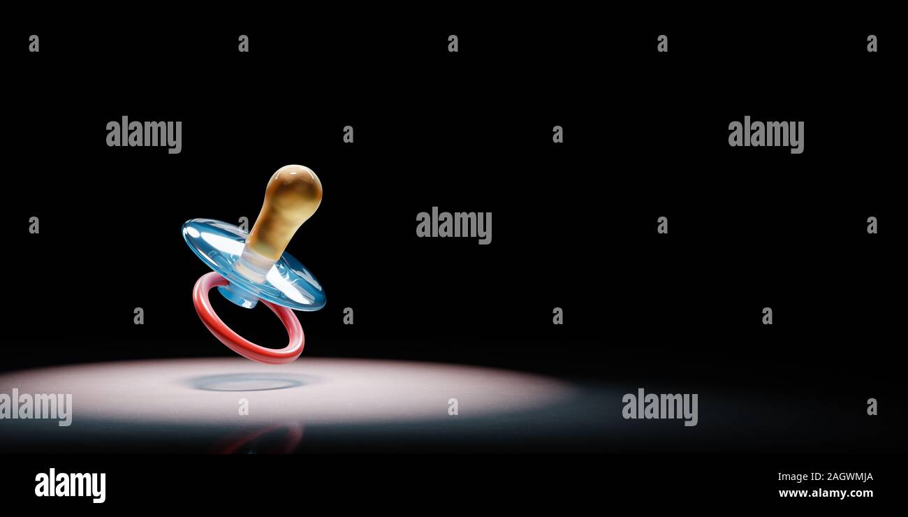 Blue and Red Baby's Pacifier Spotlighted on Black Background with Copy ...