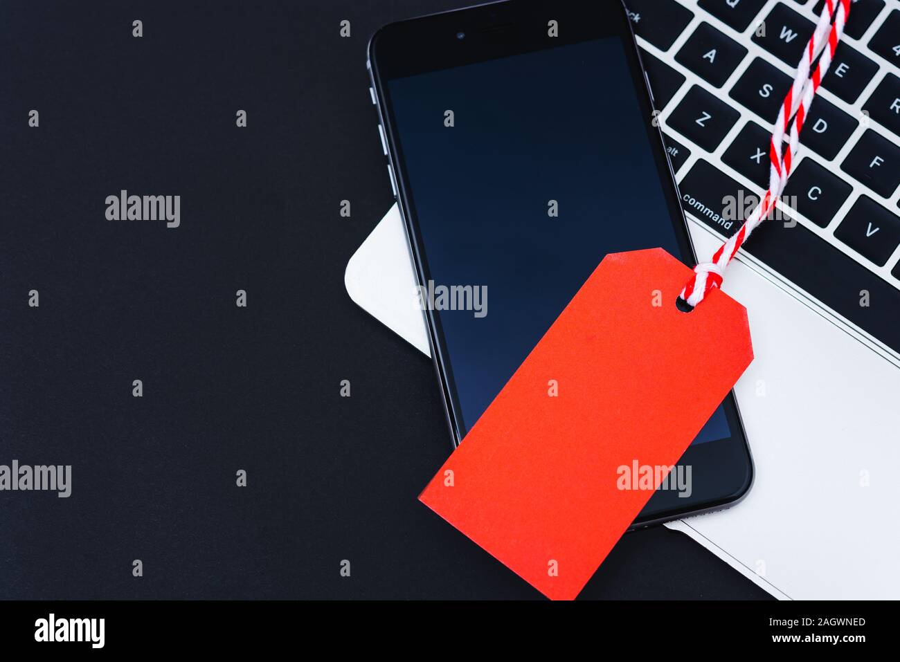 Blank Red tag have mobile smart phone over laptop computer with red ...