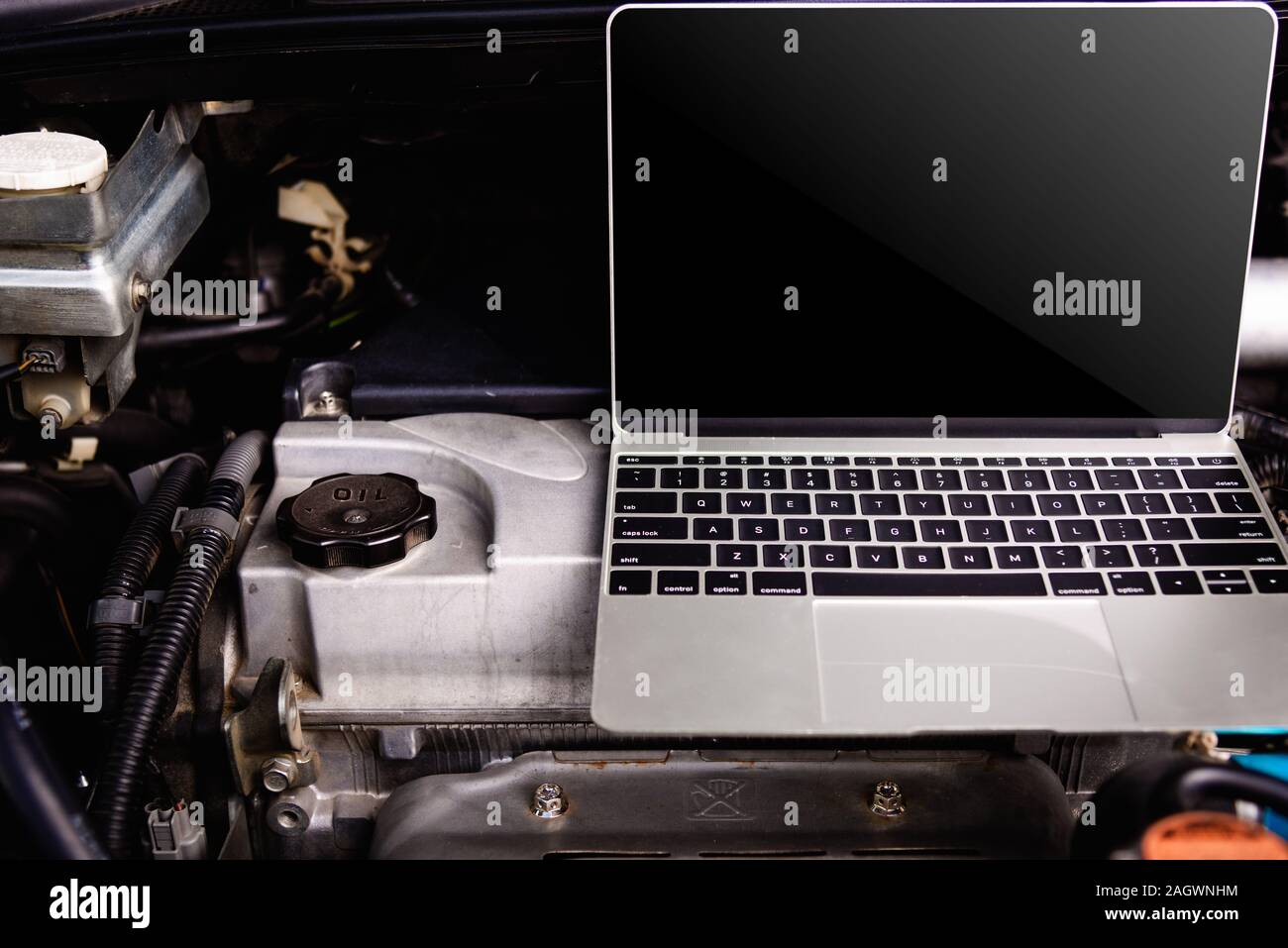 Laptop computer on car mechanic engine for service at workshop Stock ...