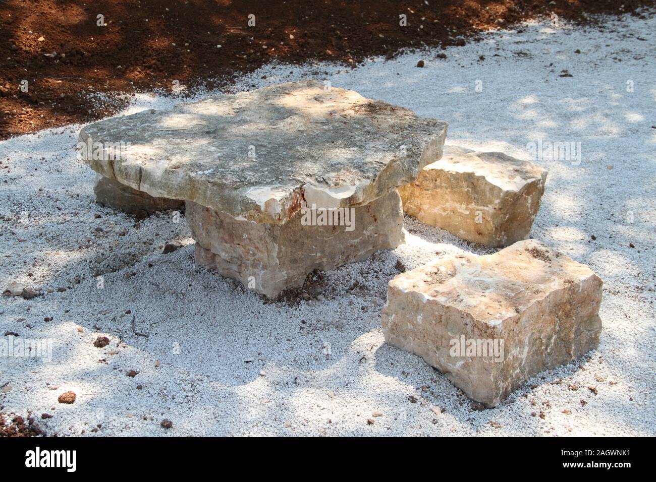 Table and chair built of rocks Stock Photo - Alamy