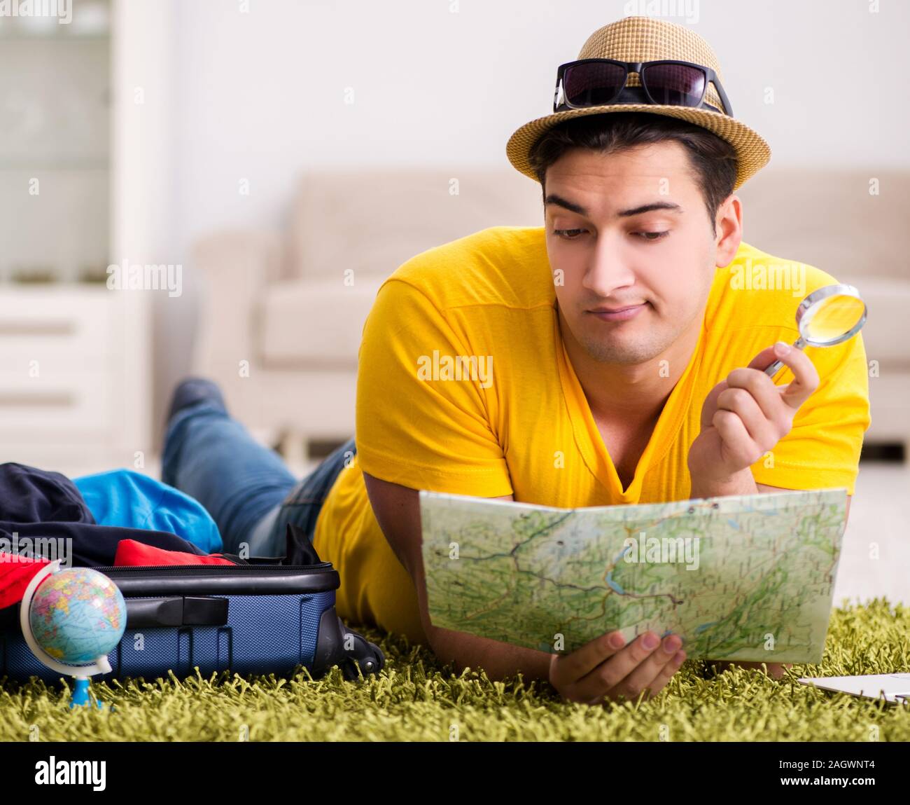 The man planning his vacation trip with map Stock Photo - Alamy
