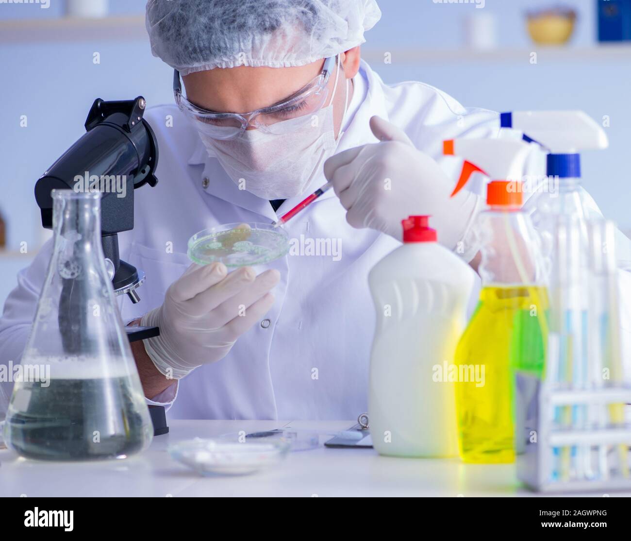 The man in the lab testing new cleaning solution detergent Stock Photo ...