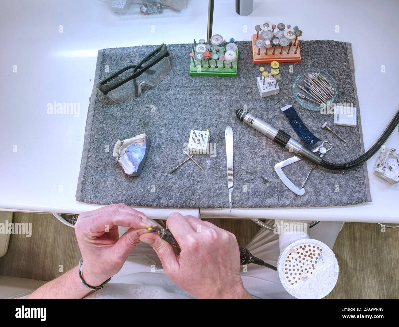 Dentist tools for grinding and shaping a metal dental prosthesis. Set ...