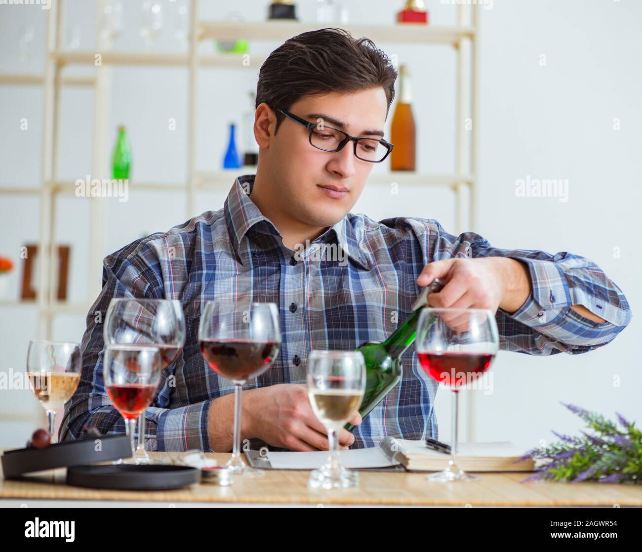 The professional sommelier tasting red wine Stock Photo - Alamy