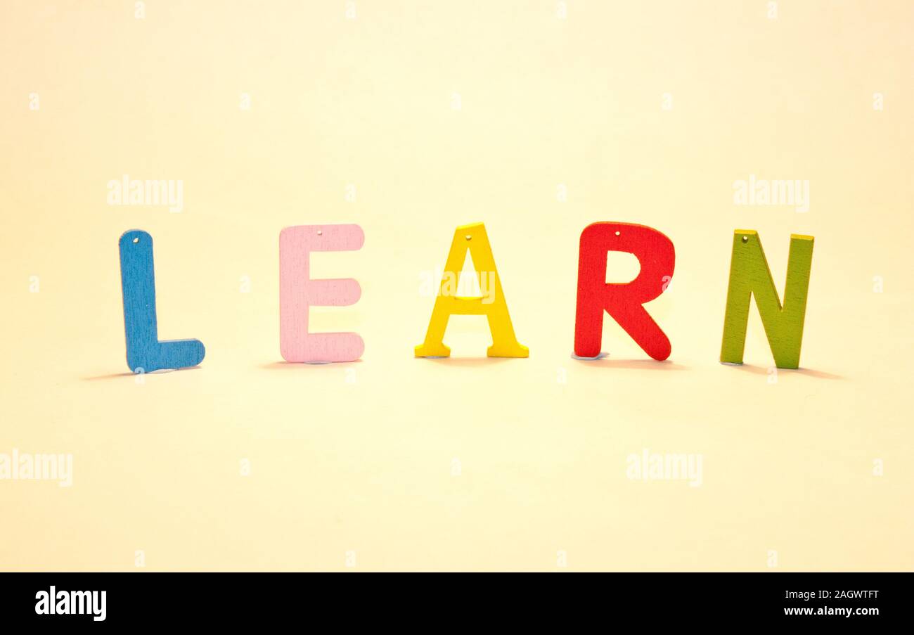 The word 'Learn' being made up from wooden coloured letters Stock Photo ...