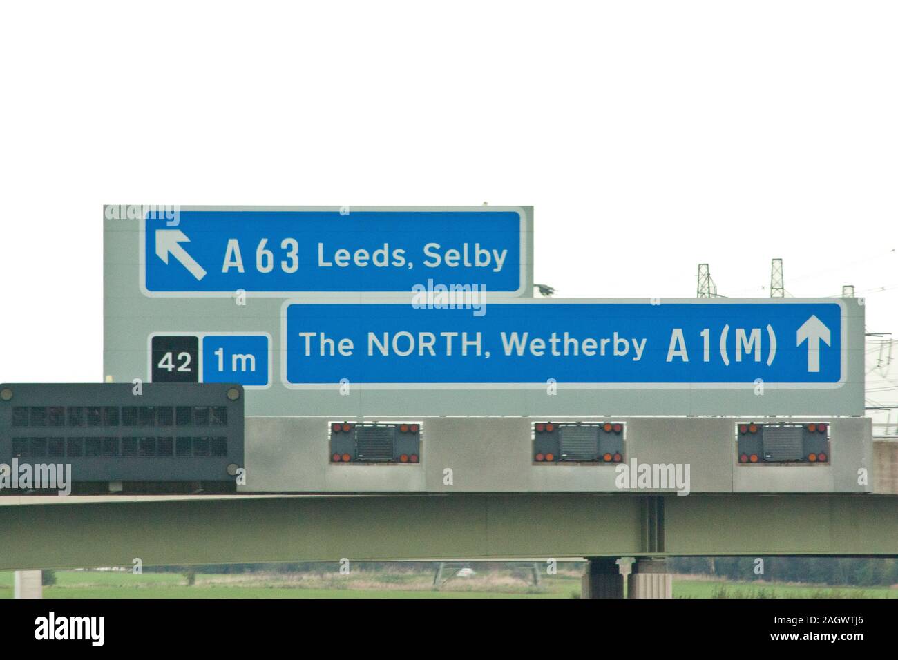 A look at the blue direction signs above a UK motorway Stock Photo - Alamy