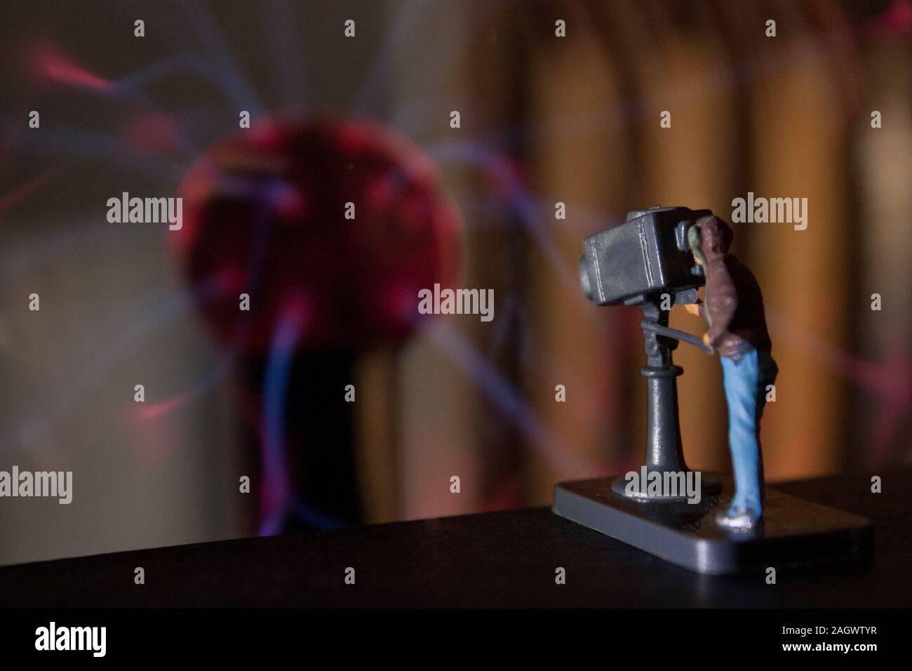 A TV cameraman films electricity for a documentary Stock Photo - Alamy