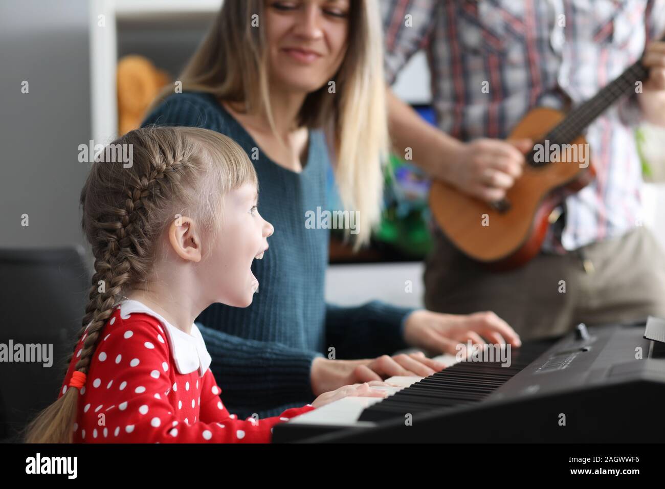 Happy family having fun at home Stock Photo - Alamy