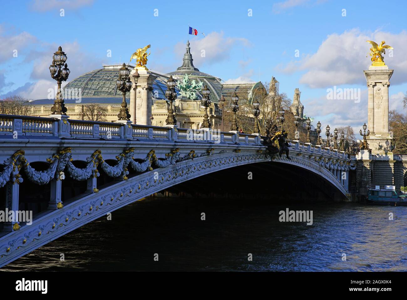 PARIS, FRANCE -20 DEC 2019- Ornate black and gold statues on the Pont ...