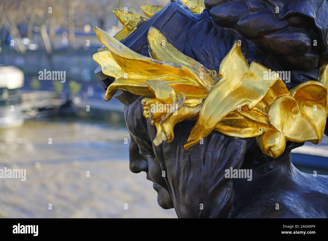 PARIS, FRANCE -20 DEC 2019- Ornate black and gold statues on the Pont ...