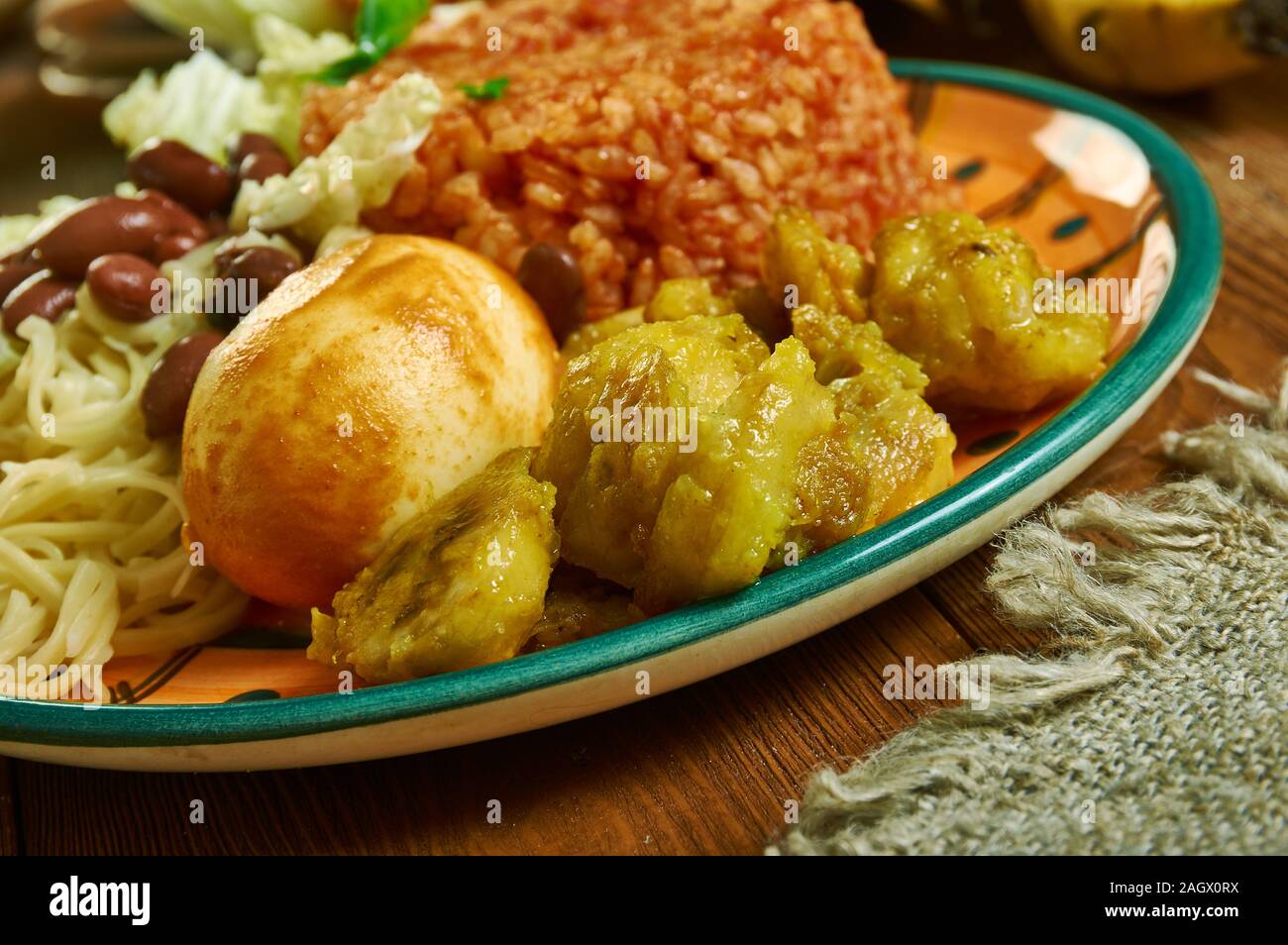 Waakye, Ghanaian cuisine, cooked rice and beans, mixed with boiled eggs ...