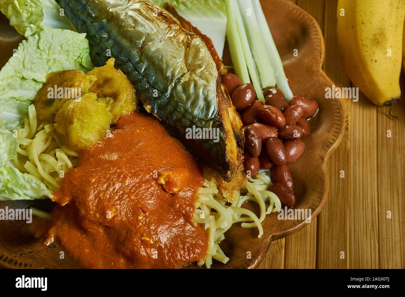 Kenkey with fried fish and chili pepper, Ghanaian cuisine, Traditional ...