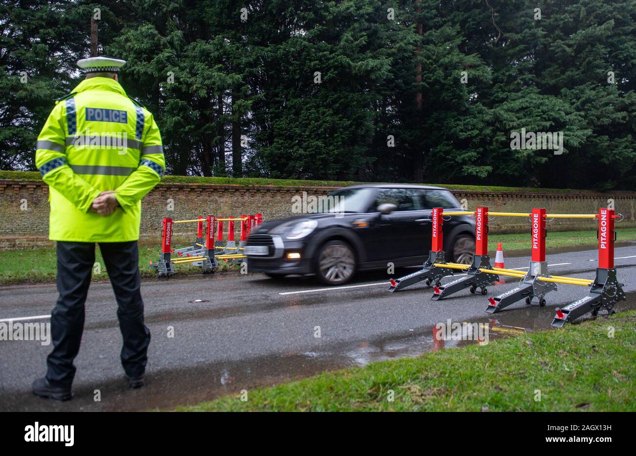 Police using anti-vehicle barriers at a security checkpoint ahead of ...
