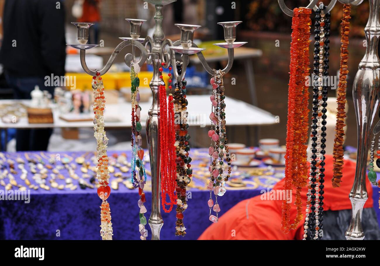 market stall at portobello road market with chains hanging at silver ...