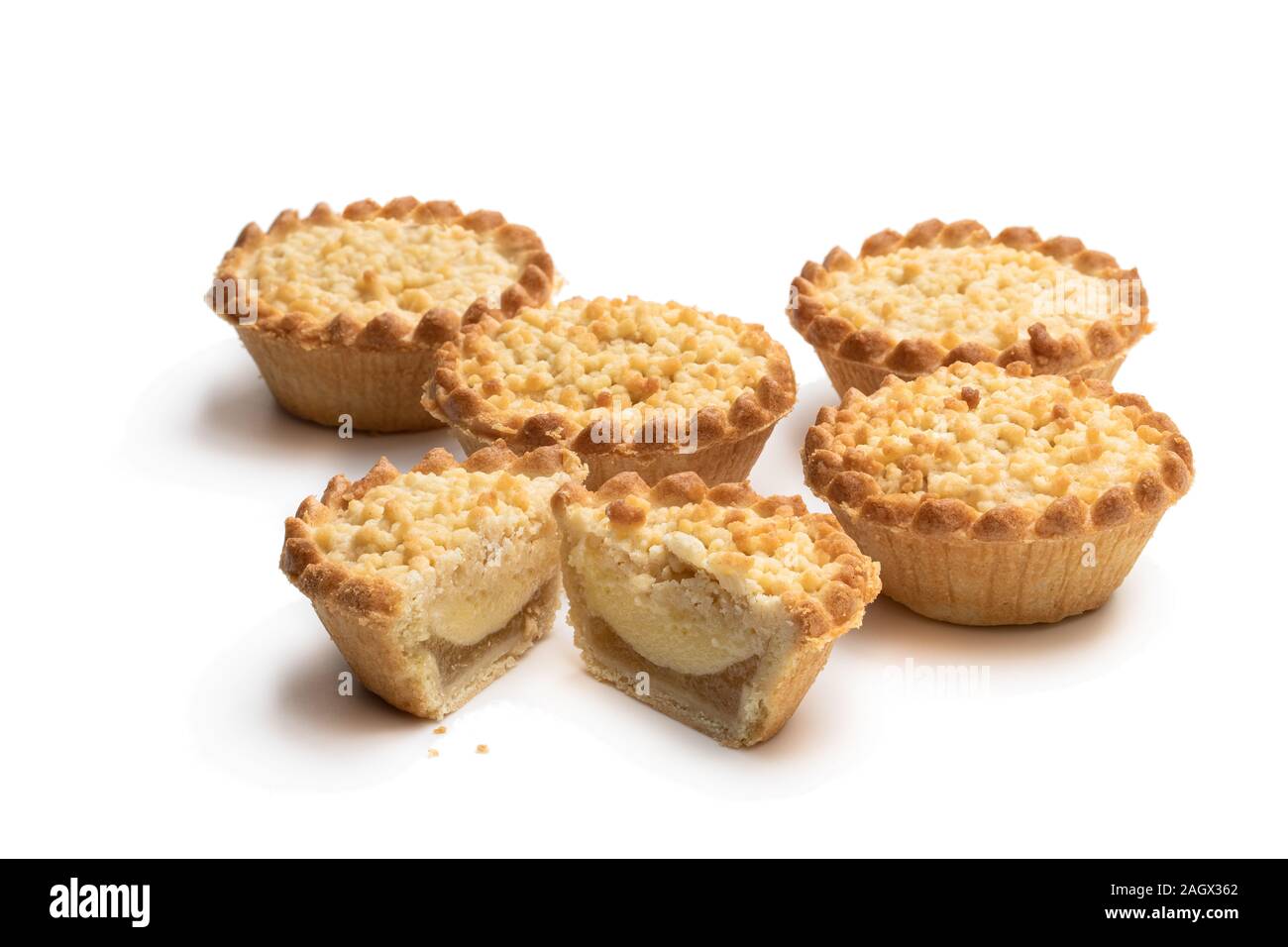 Mini apple and pear custard crumble tarts isolated on white Stock Photo ...
