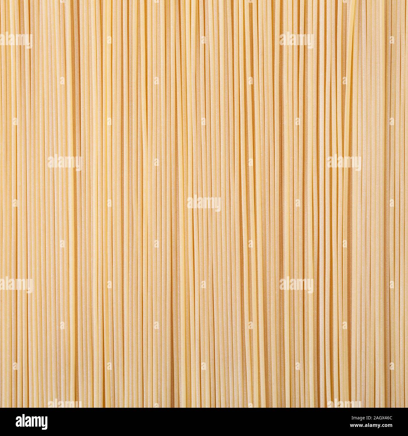 Uncooked dried spaghetti pasta background Stock Photo - Alamy